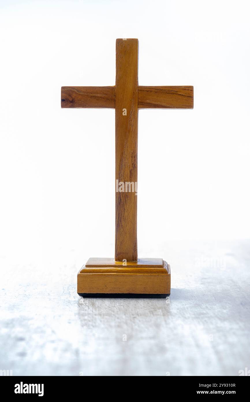 Wooden religion cross standing on bright background. Religious ...