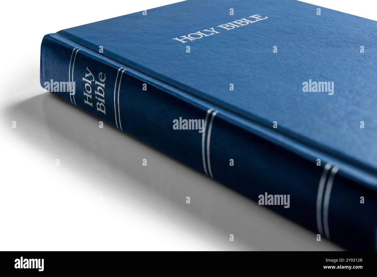 Blue book with the word Holy Bible on the front isolated over white ...