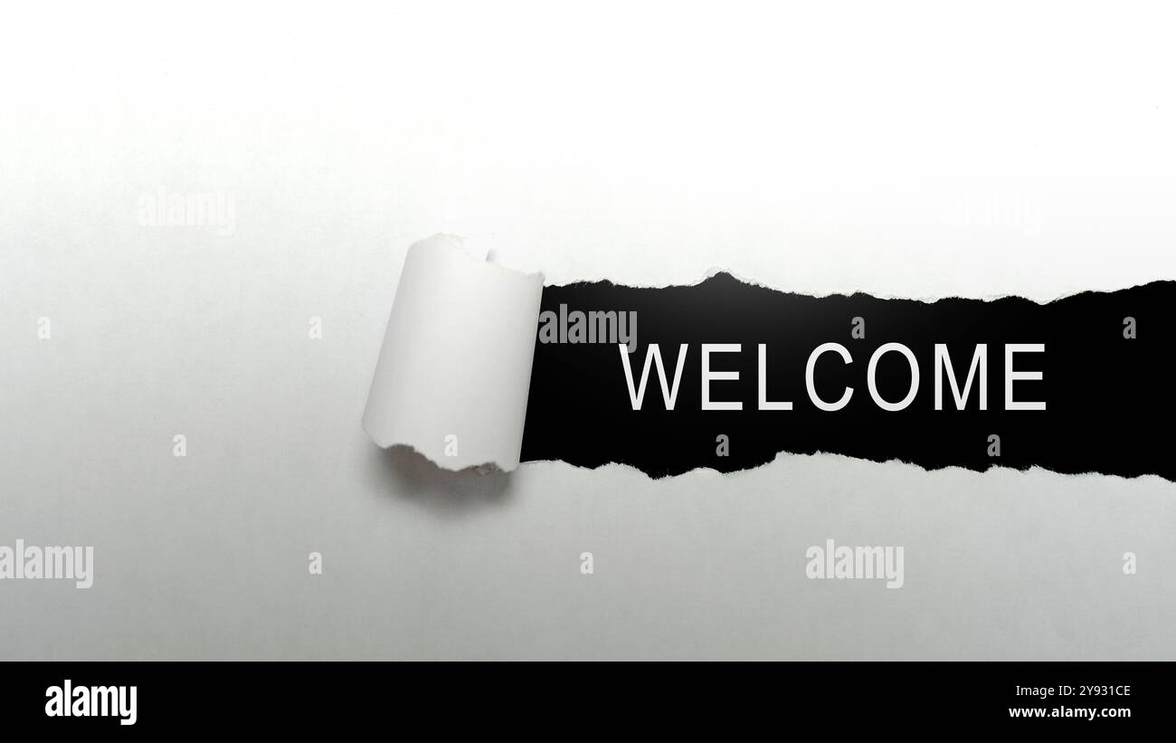 Torn piece of paper showing word "Welcome" written on it. Welcome ...