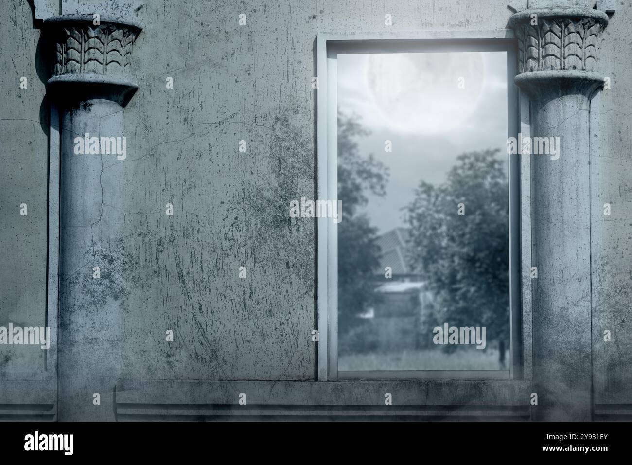 Window between two pillars on abandoned building. Full moon through ...