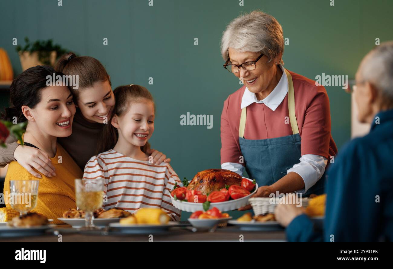 Happy Thanksgiving Day. Autumn feast. Family sitting at the table and ...