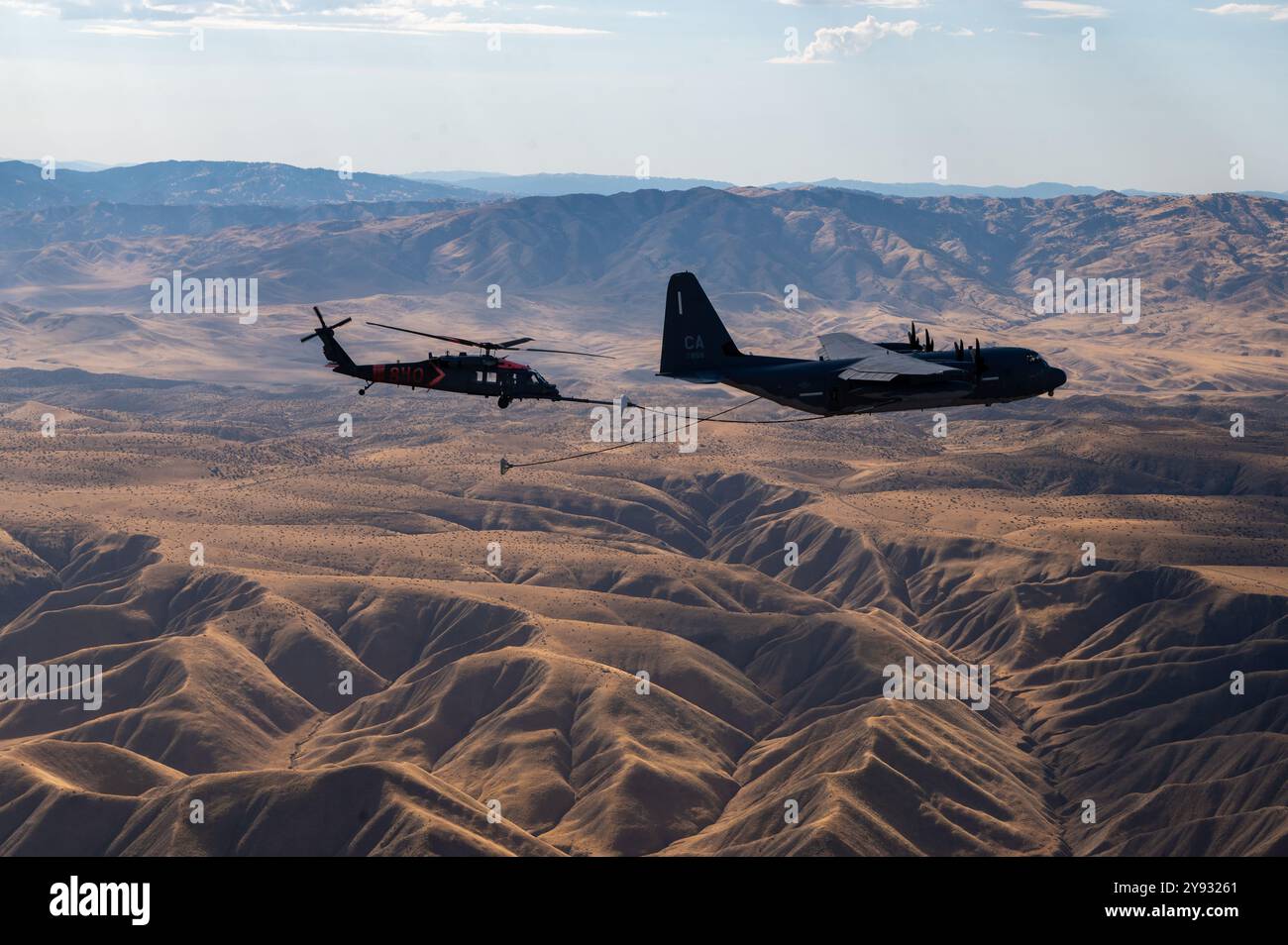 U.S. Air Force HH-60G Pave Hawk helicopters and HC-130J Combat King II ...