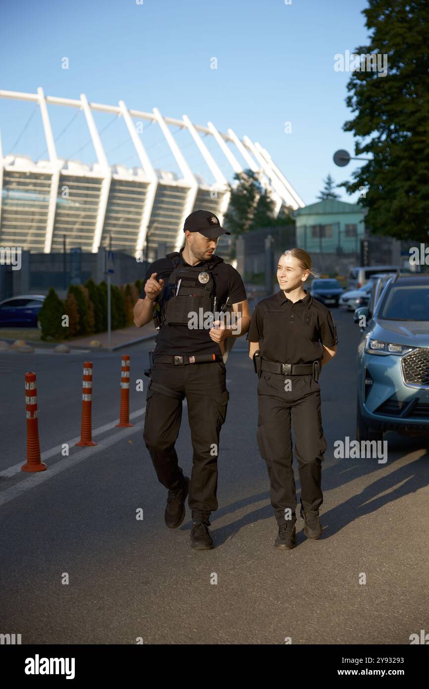 Friendly smiling patrol police officers outdoor Stock Photo - Alamy