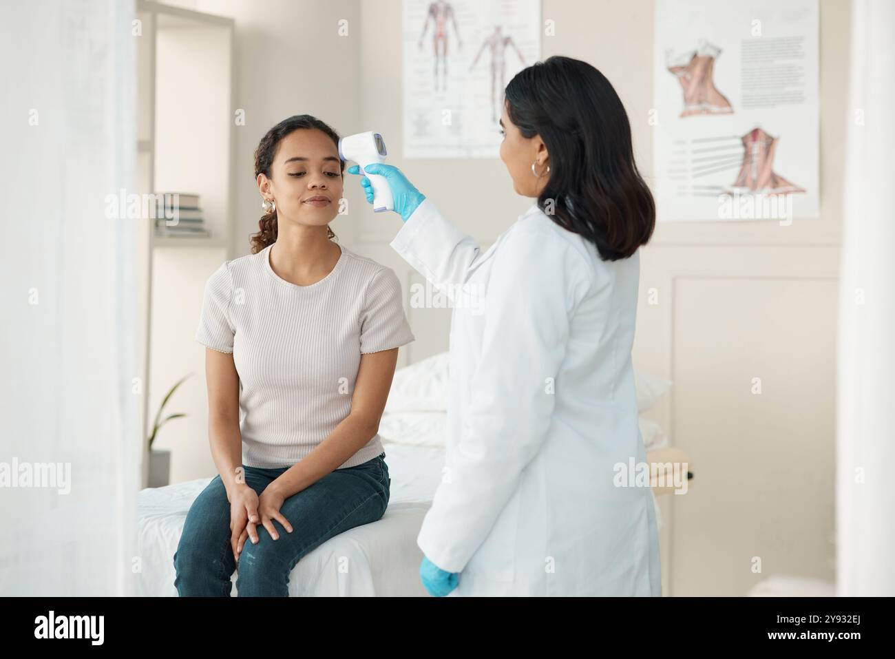 Temperature, checkup and woman with doctor at clinic for flu, cold or ...
