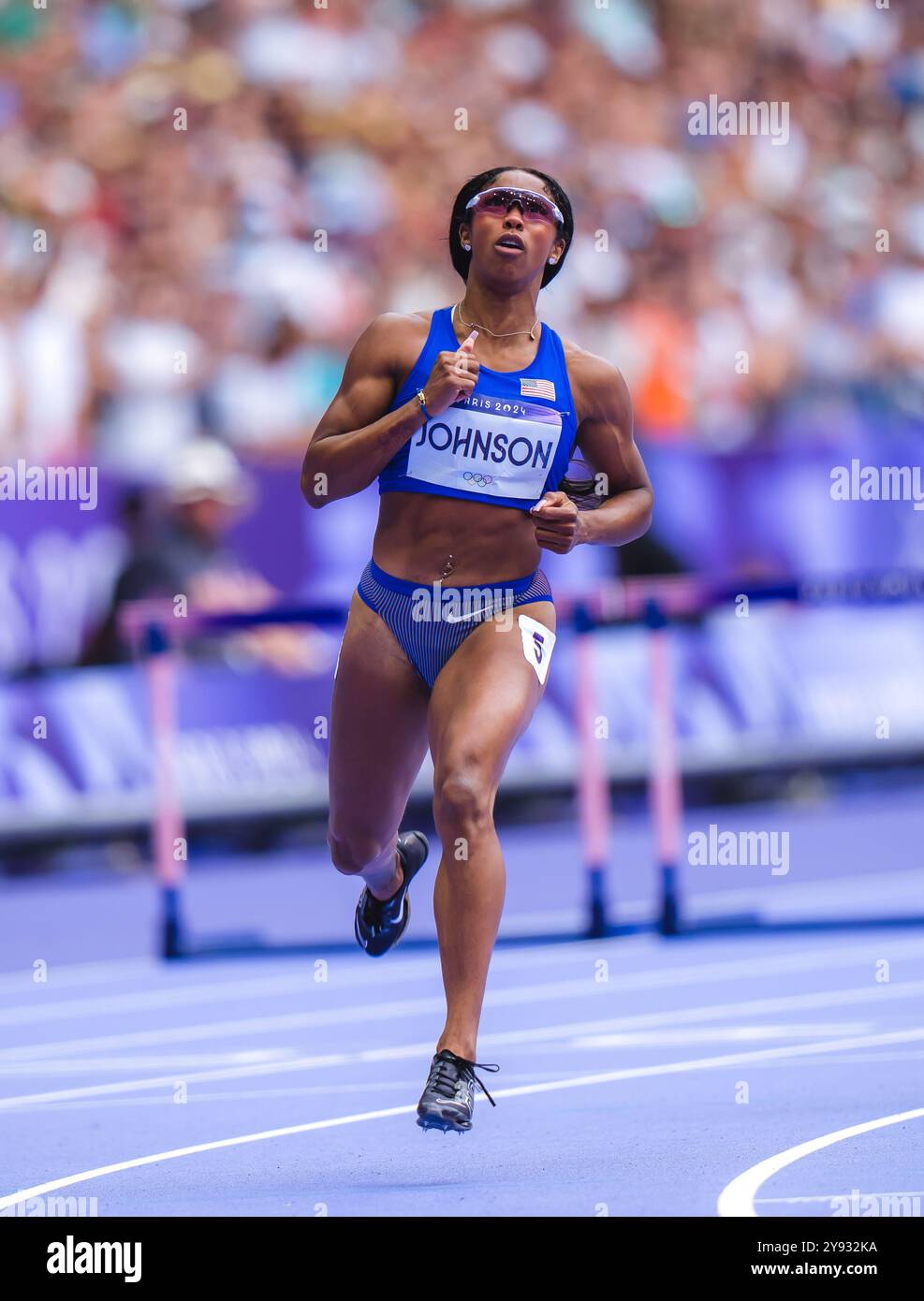 Alaysha Johnson participating in the 100 meters hurdles at the Paris ...