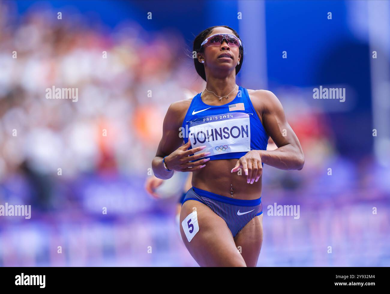 Alaysha Johnson participating in the 100 meters hurdles at the Paris ...