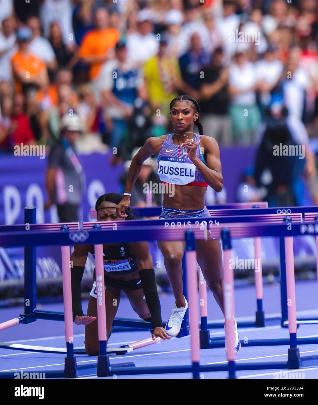 Masai Russell participating in the 100 meters hurdles at the Paris 2024 ...
