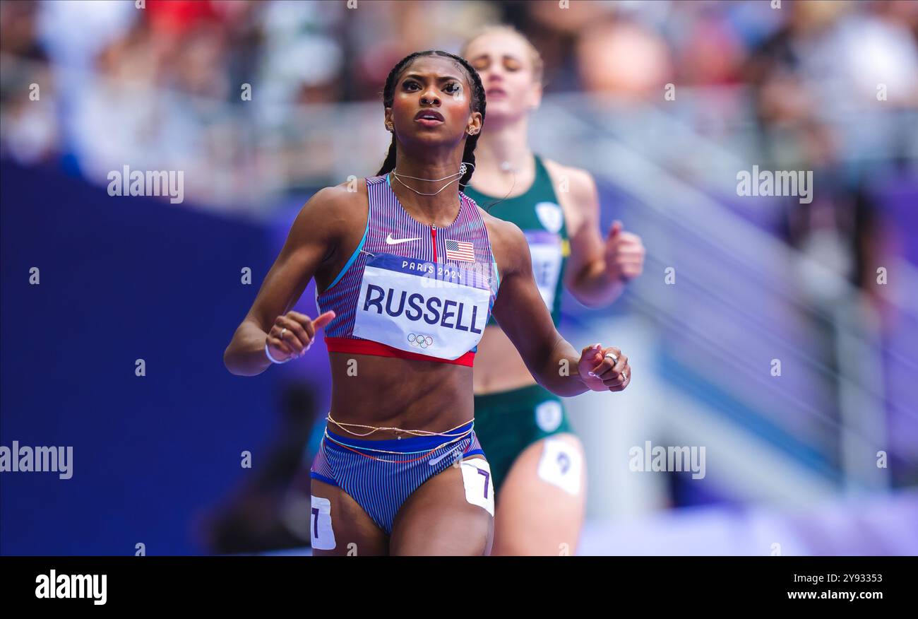Masai Russell participating in the 100 meters hurdles at the Paris 2024 ...