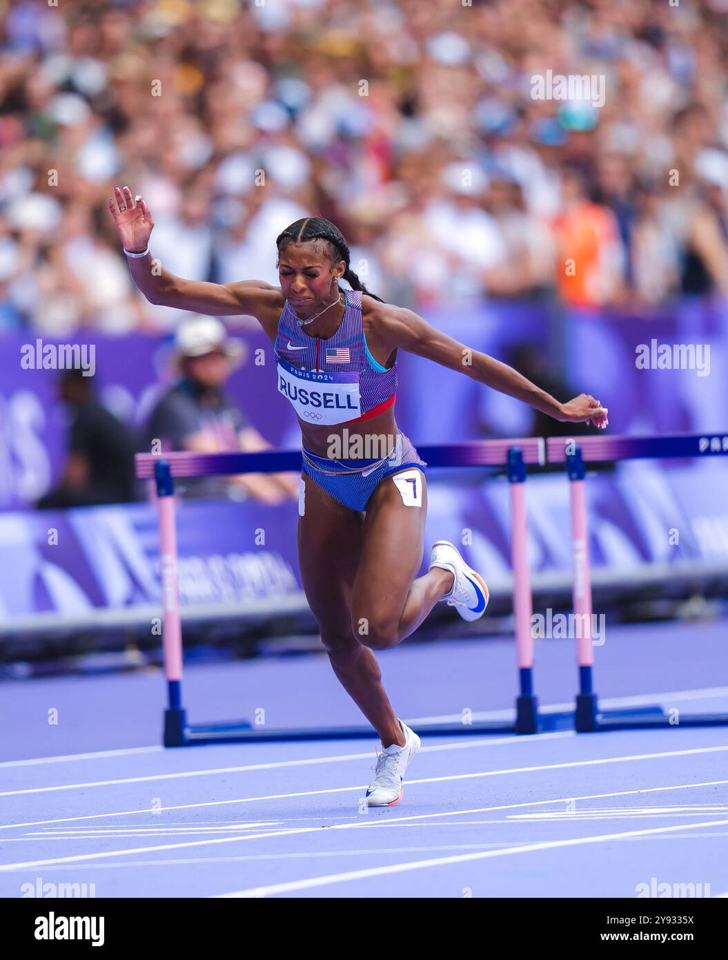 Masai Russell participating in the 100 meters hurdles at the Paris 2024 ...