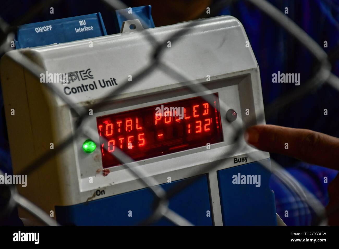 Srinagar, India. 08th Oct, 2024. An electoral official counts votes ...