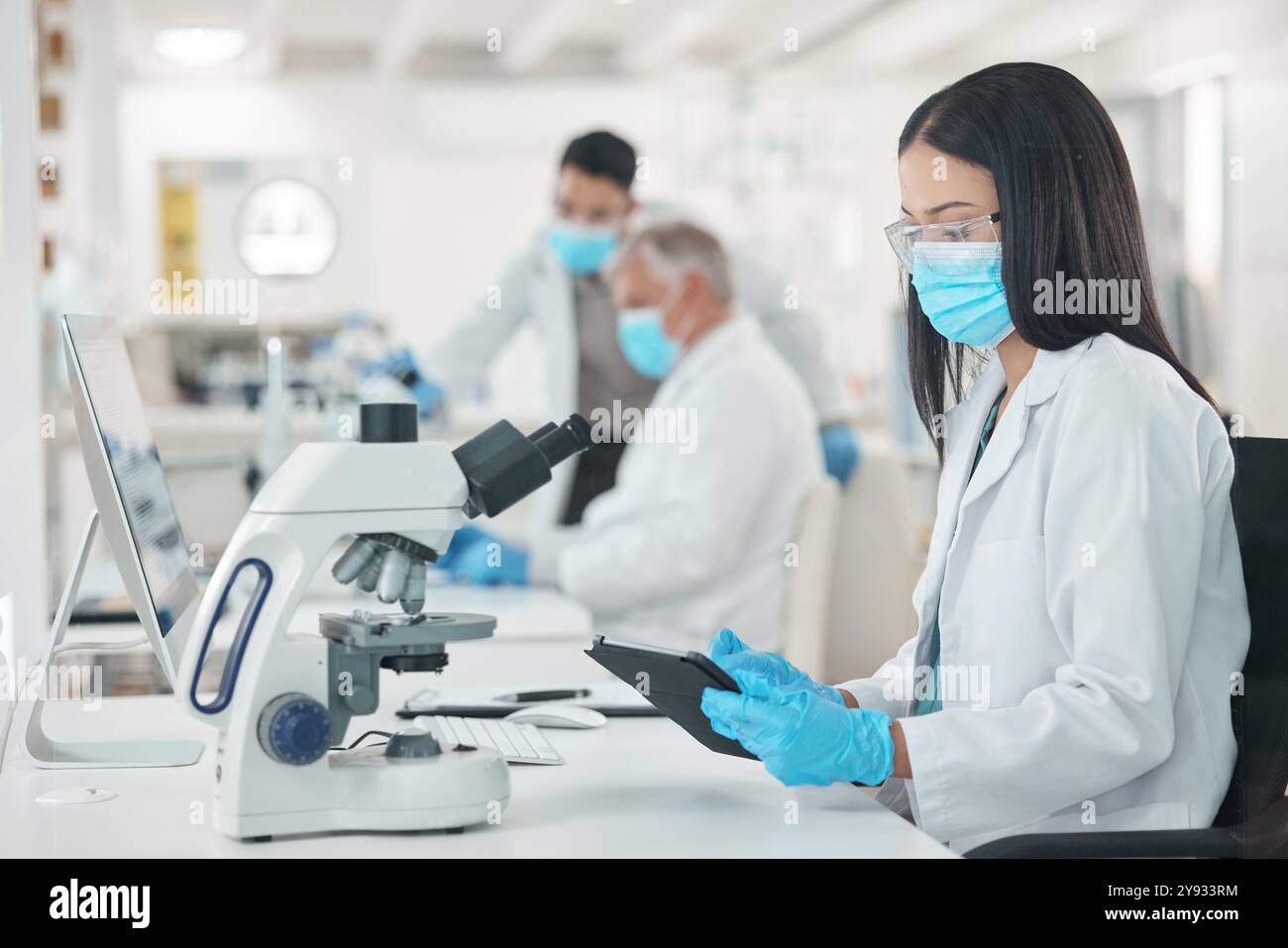 Scientist, tablet and woman with microscope in lab for medical database ...