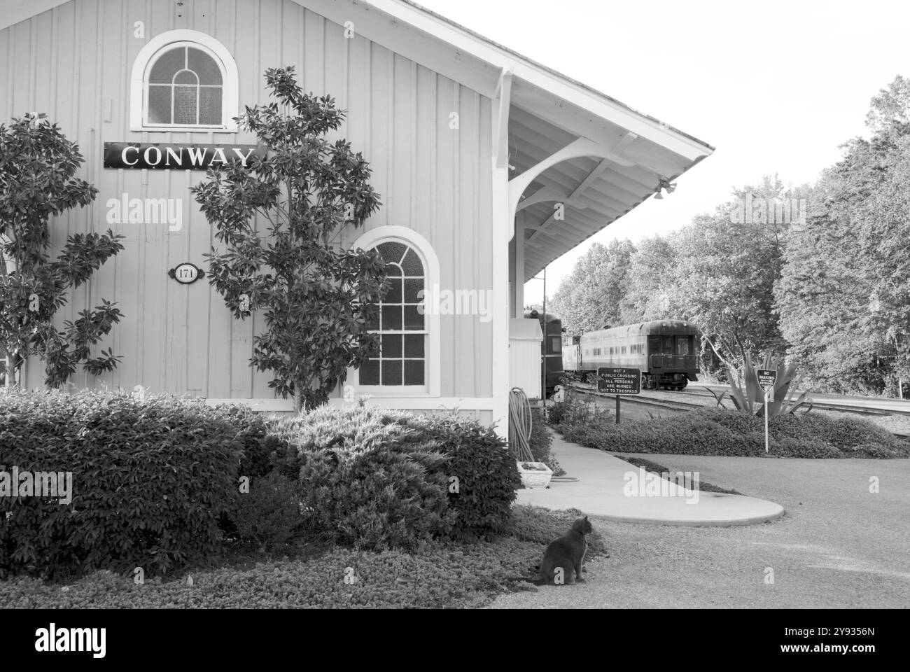 Railroad depot and old train car at Conway, South Carolina, USA, showcasing a historic site with ...