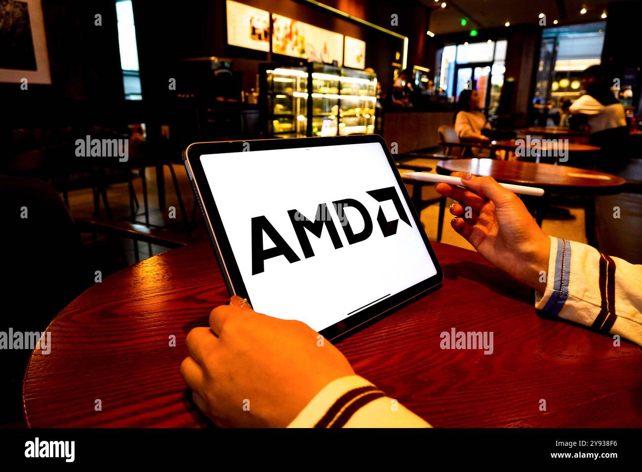 In this photo illustration, an AMD logo is displayed on the screen of a ...
