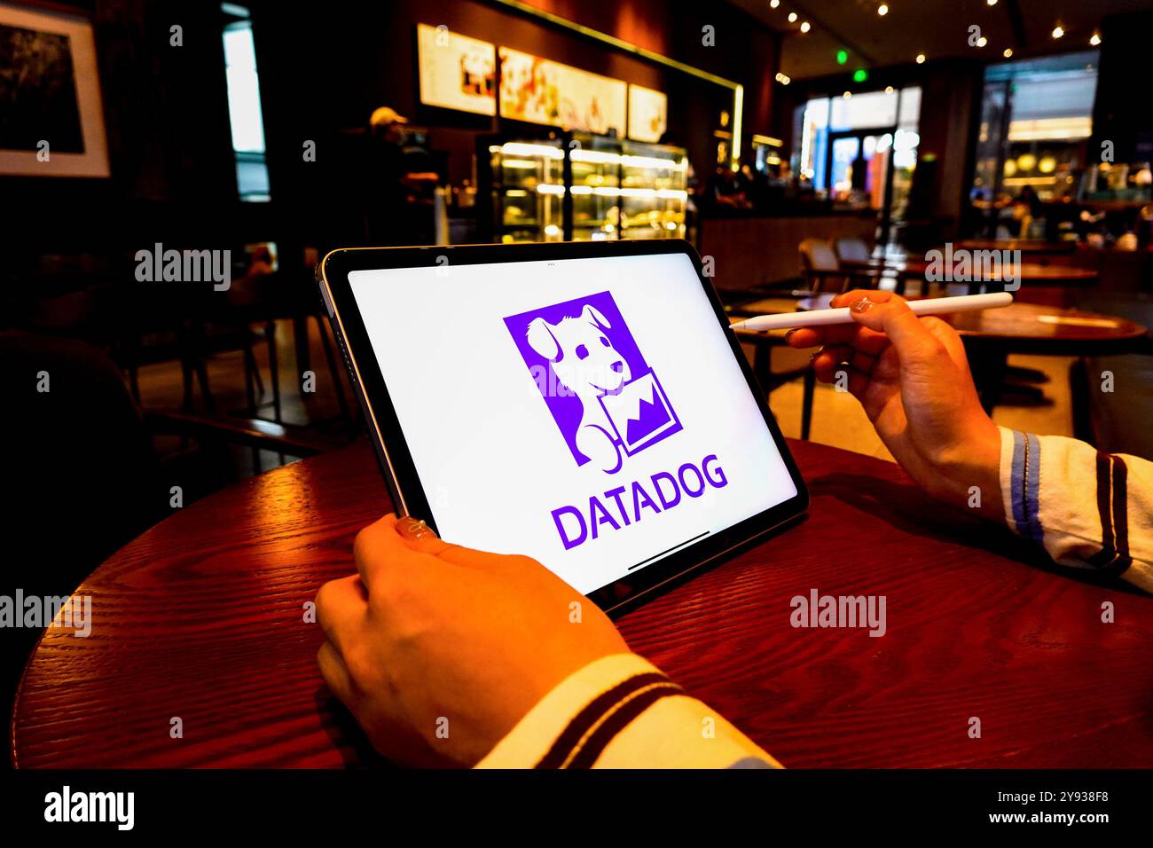 In this photo illustration, a Datadog logo is displayed on the screen ...