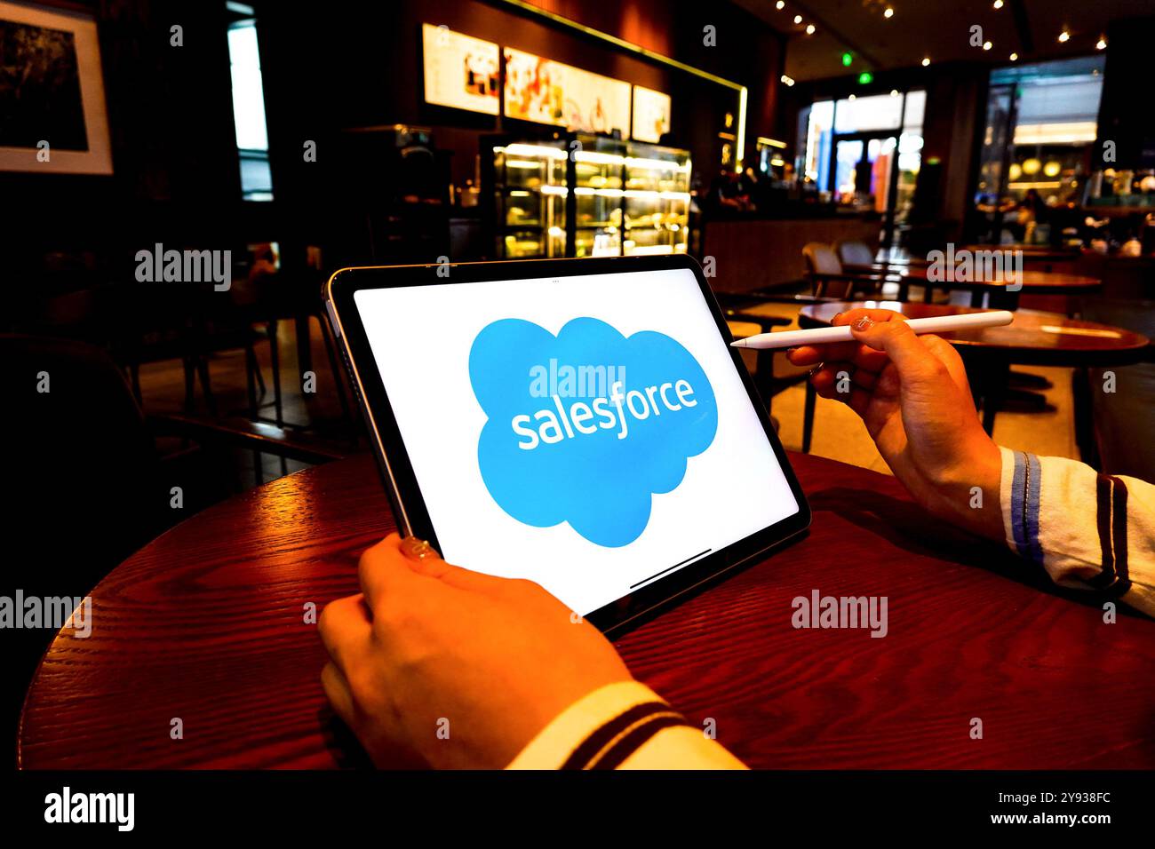 In this photo illustration, a Salesforce logo is displayed on the ...