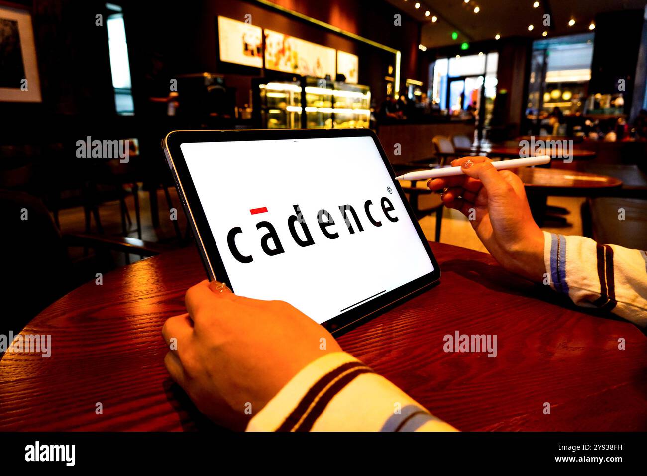 In this photo illustration, a Cadence Design Systems logo is displayed ...
