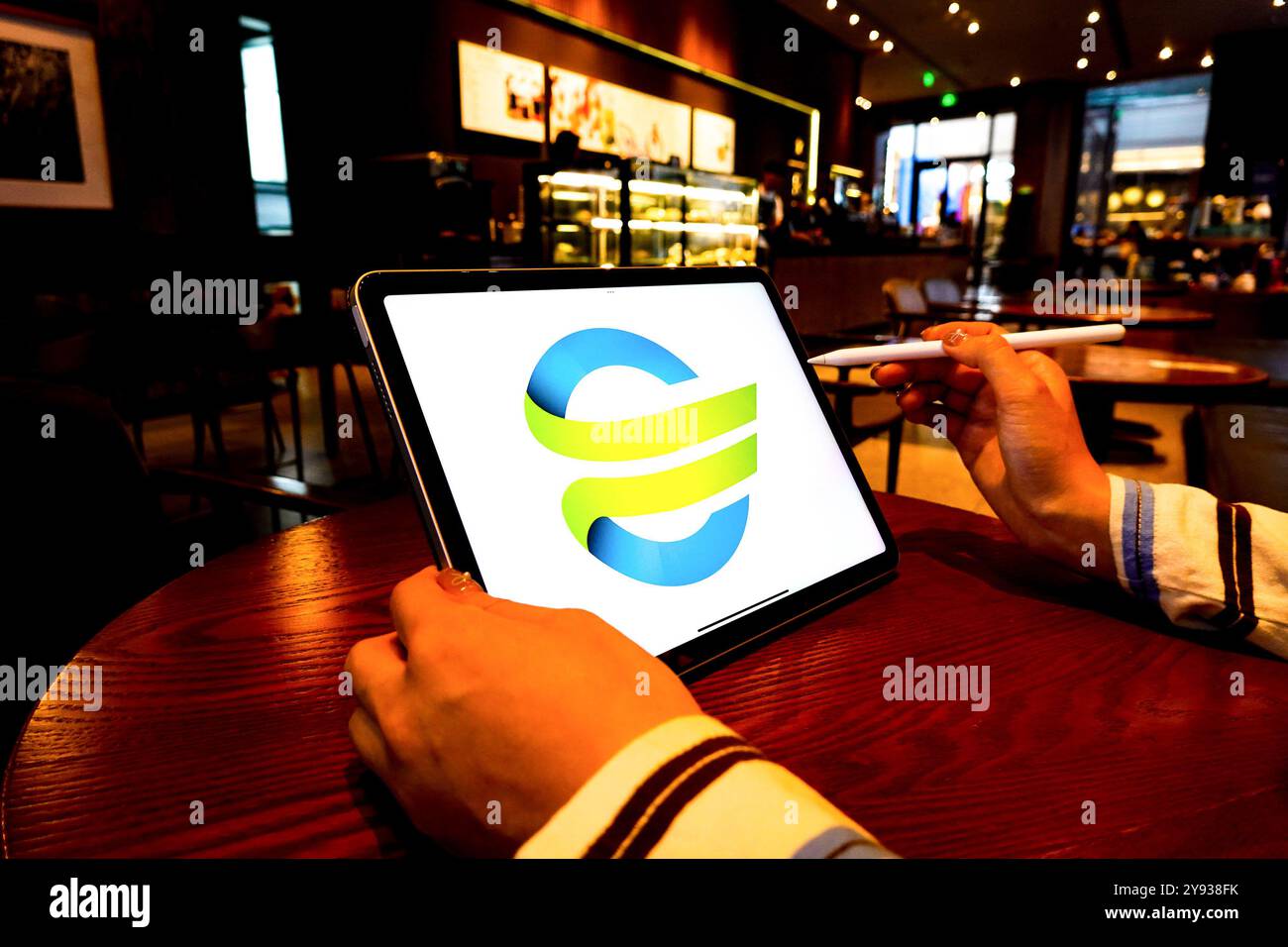 In this photo illustration, a Cerner logo is displayed on the screen of ...