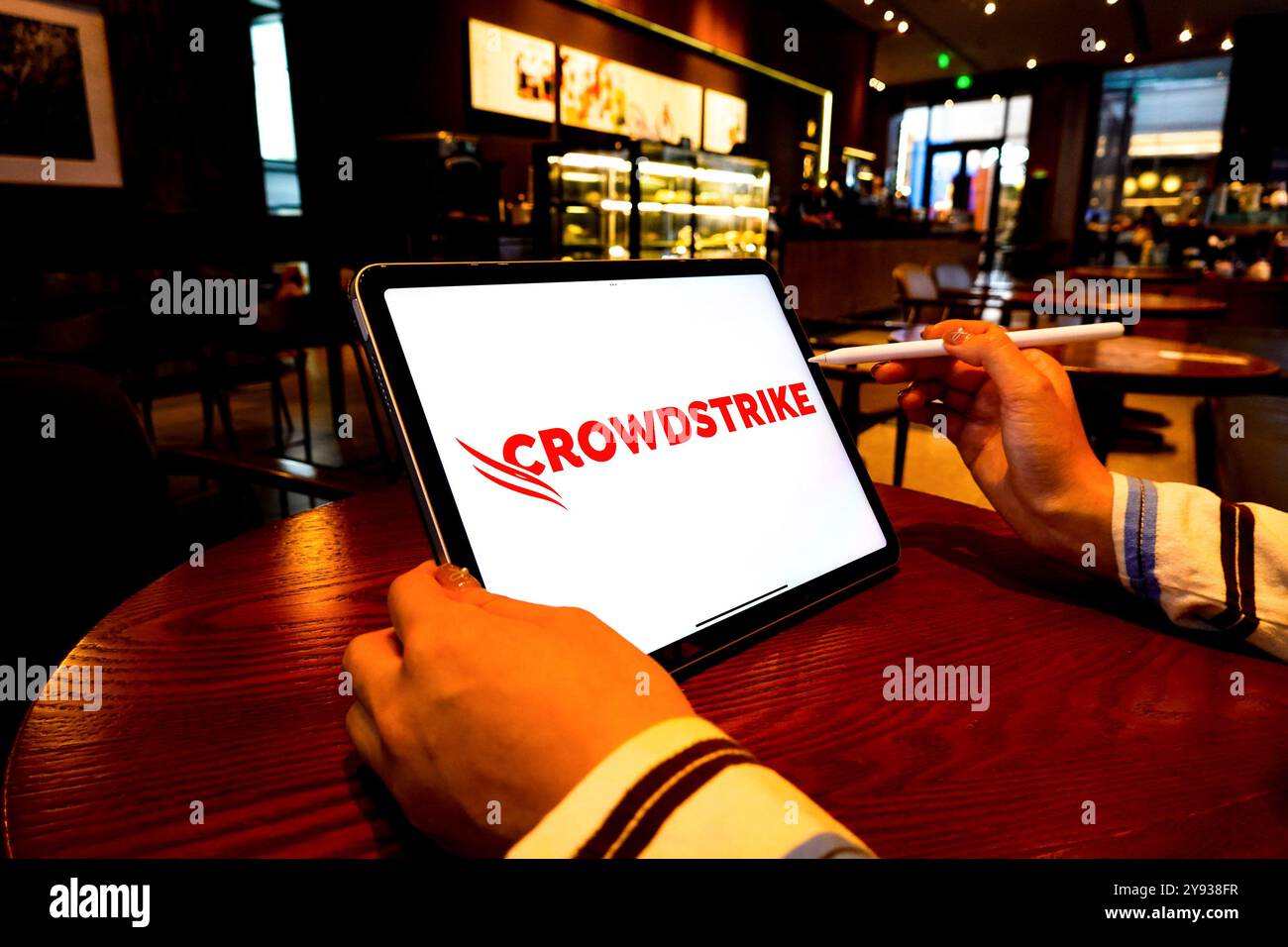 In this photo illustration, a CrowdStrike logo is displayed on the ...