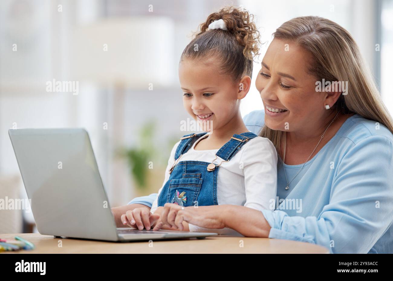 Mother, daughter and elearning with laptop for online education ...