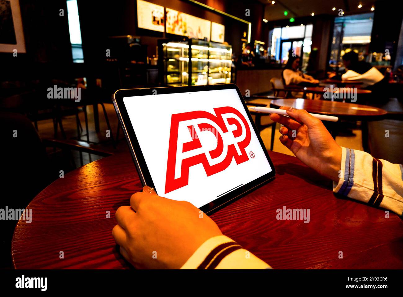 China. 07th Oct, 2024. In this photo illustration, an ADP (Automatic ...