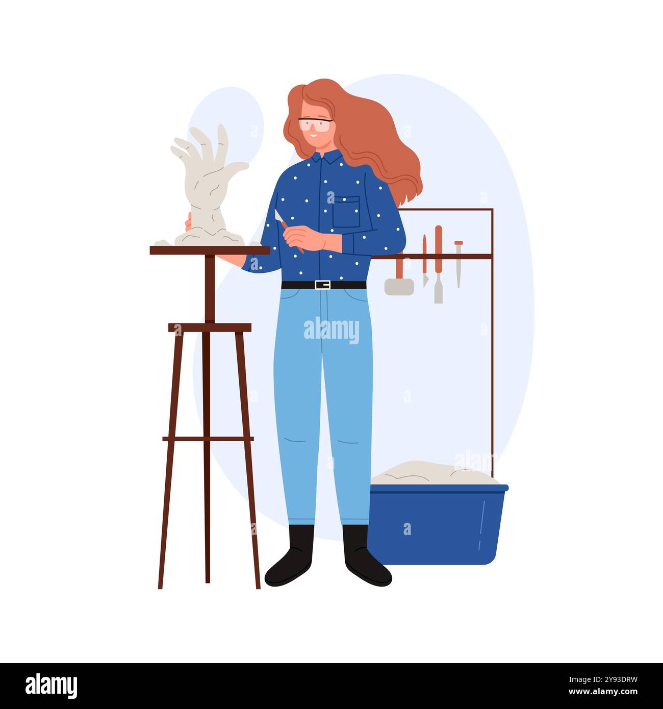 Sculptor in safety glasses standing at hand statue on stand, woman in ...