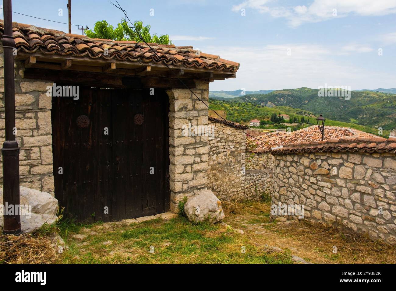 A gate in a wall belonging to an historic residential building within ...