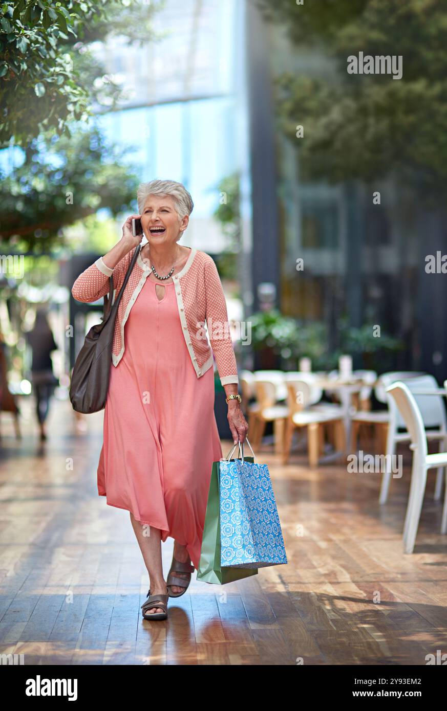 Phone call, shopping or senior woman in mall for retail with smile ...