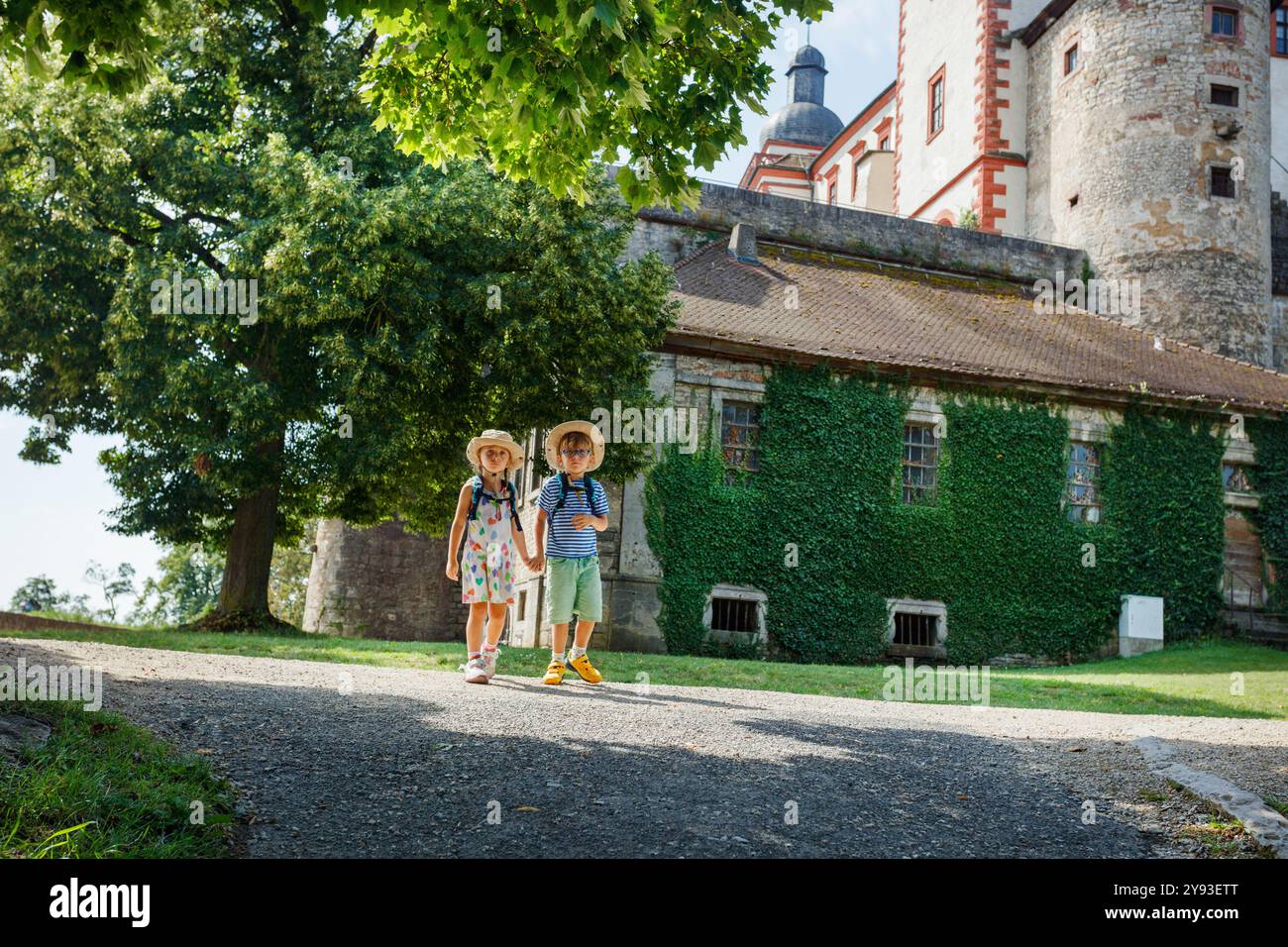 Happy children exploring a Marienberg castle on lovely sunny day Stock ...