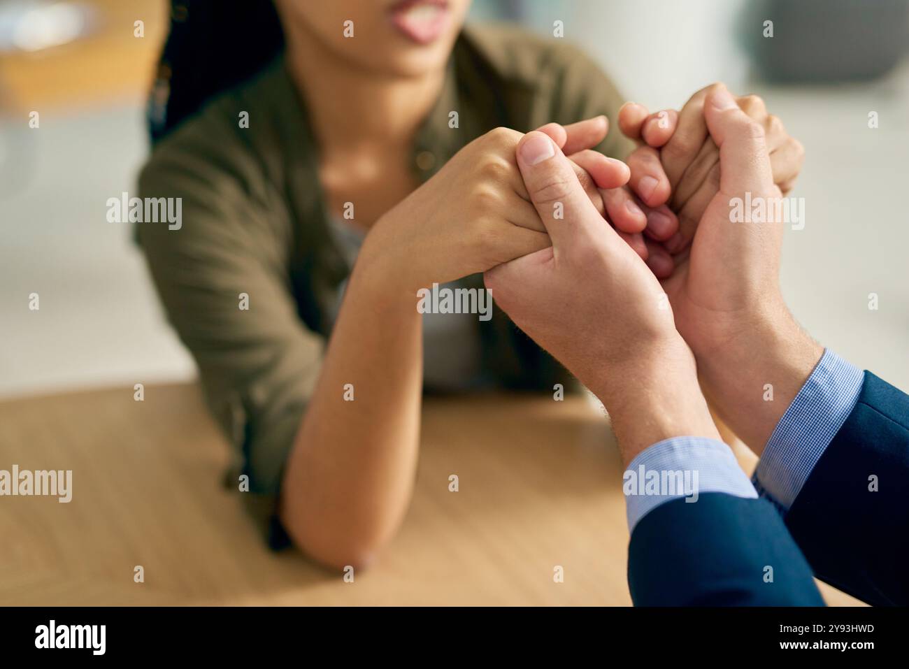 Employees, holding hands and desk for compassion in office, kindness ...