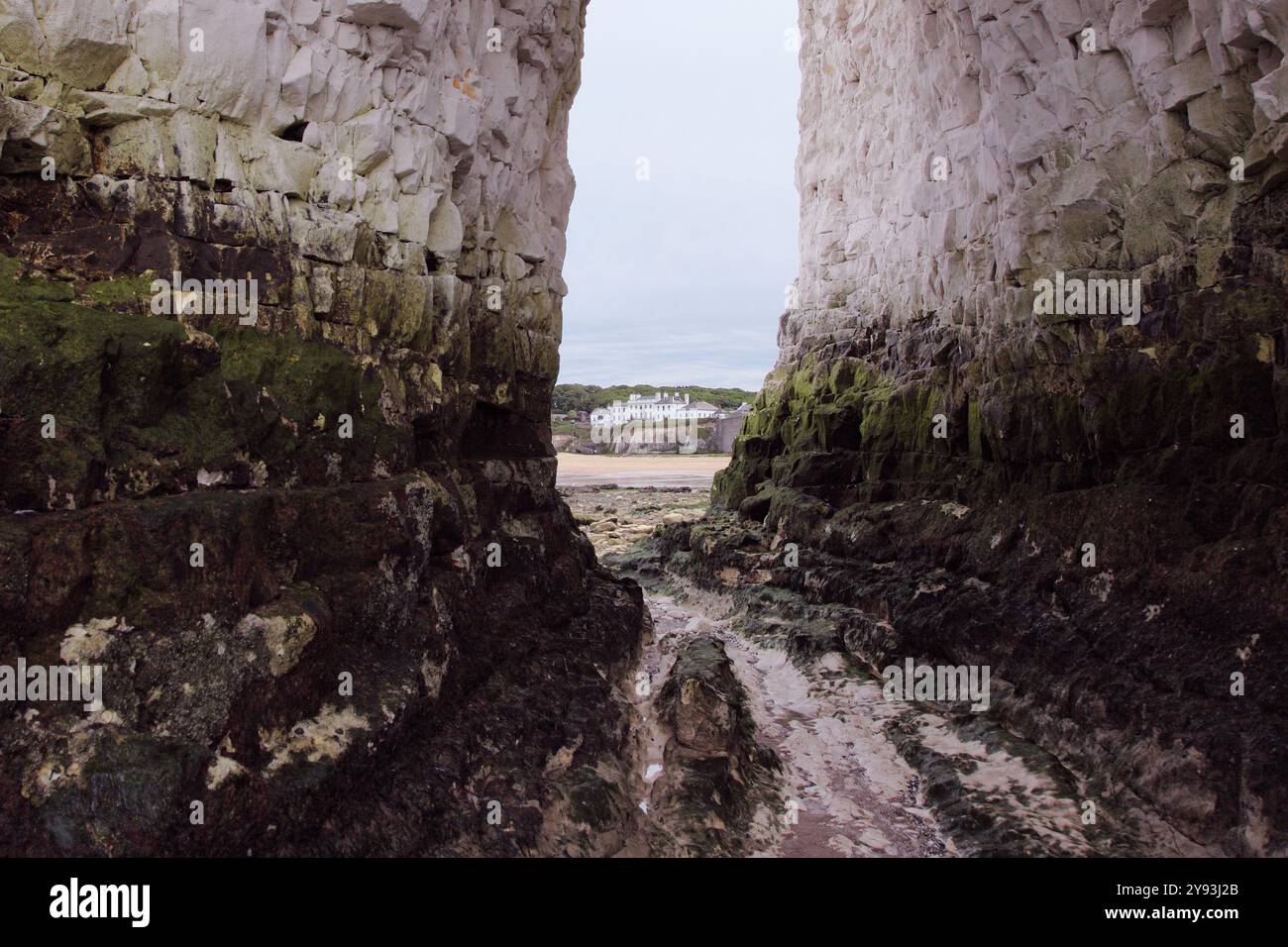 Georgian Holland House seen through a chalk sea cliffs at Kingsgate Bay ...