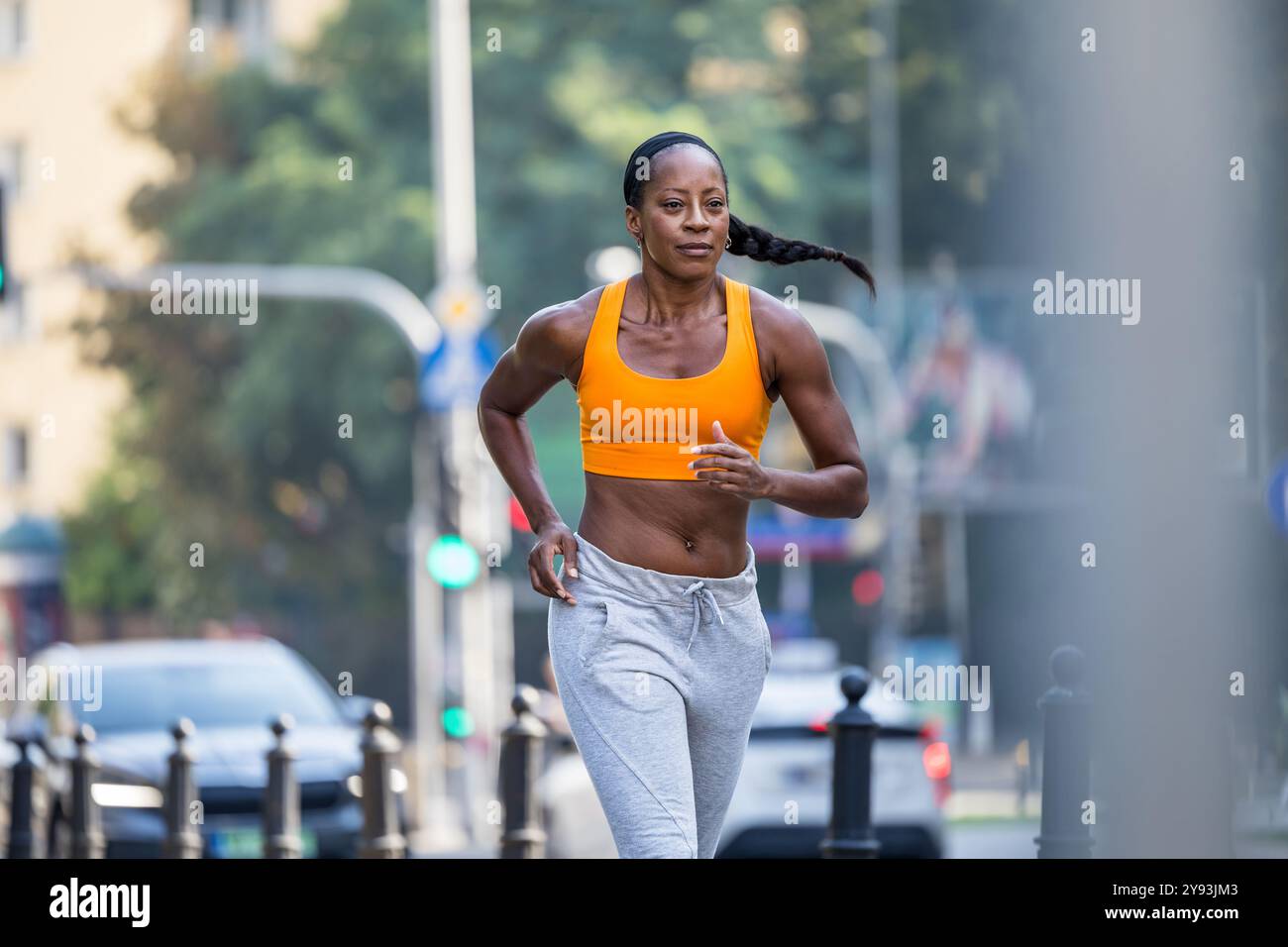 Sporty african woman running on hi-res stock photography and images - Alamy