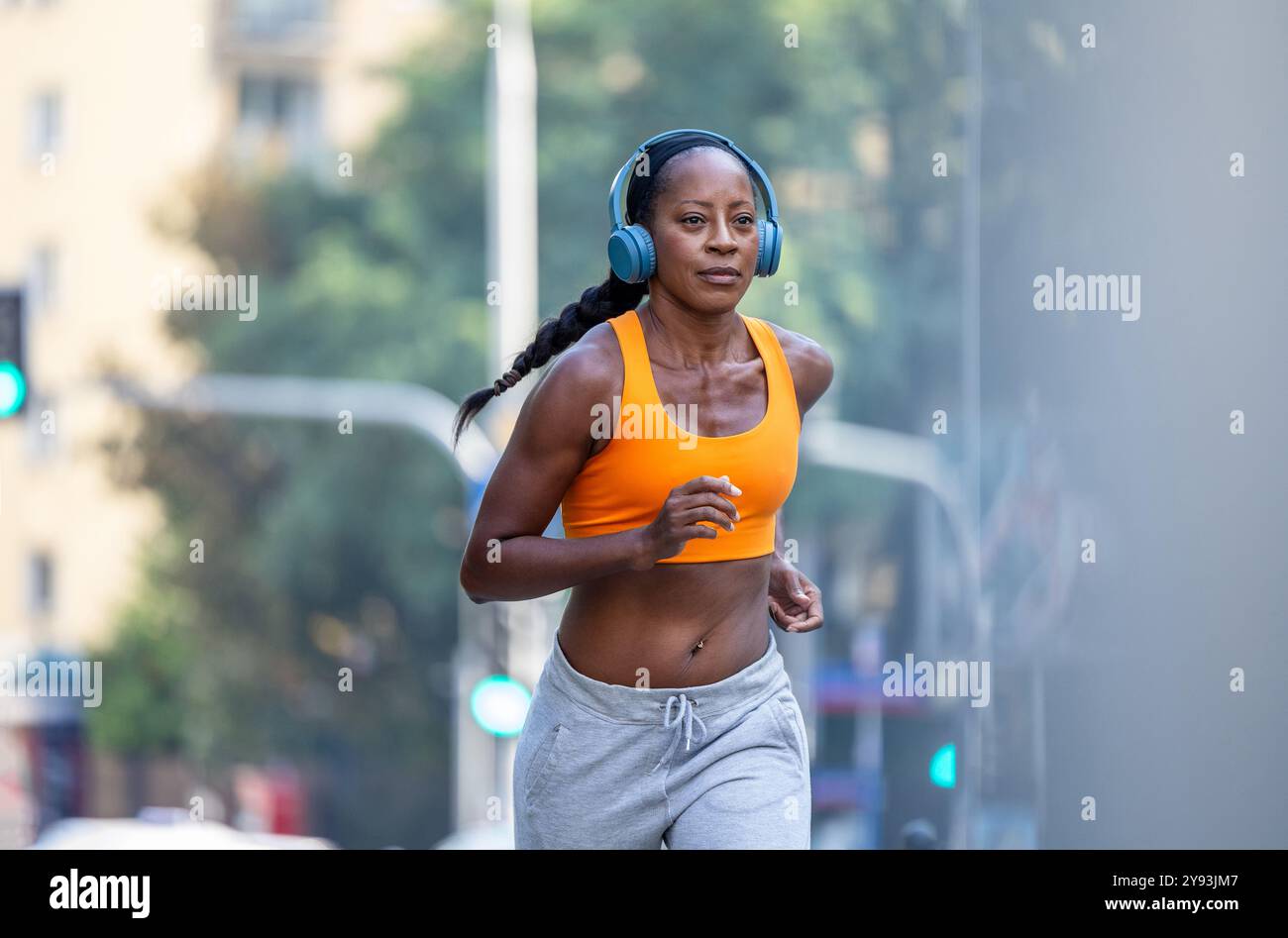 Sporty african woman running on hi-res stock photography and images - Alamy