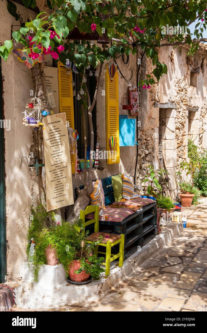 colourful frontage of Greek taverna with bougainvillea and brightly ...