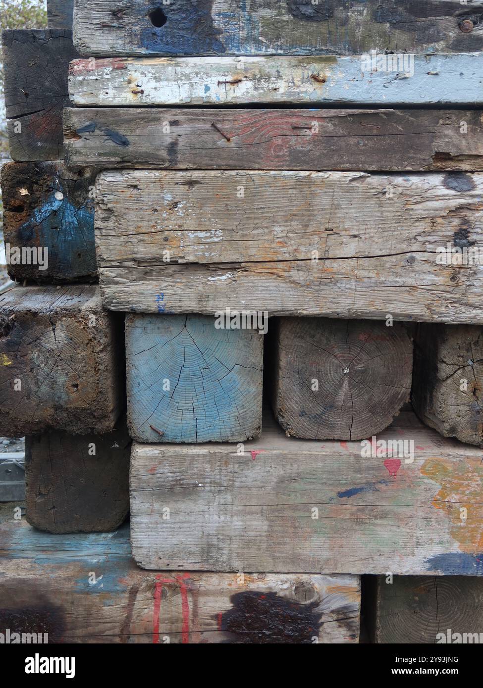 A stack of wooden blocks at a boatyard creates an abstract picture of ...