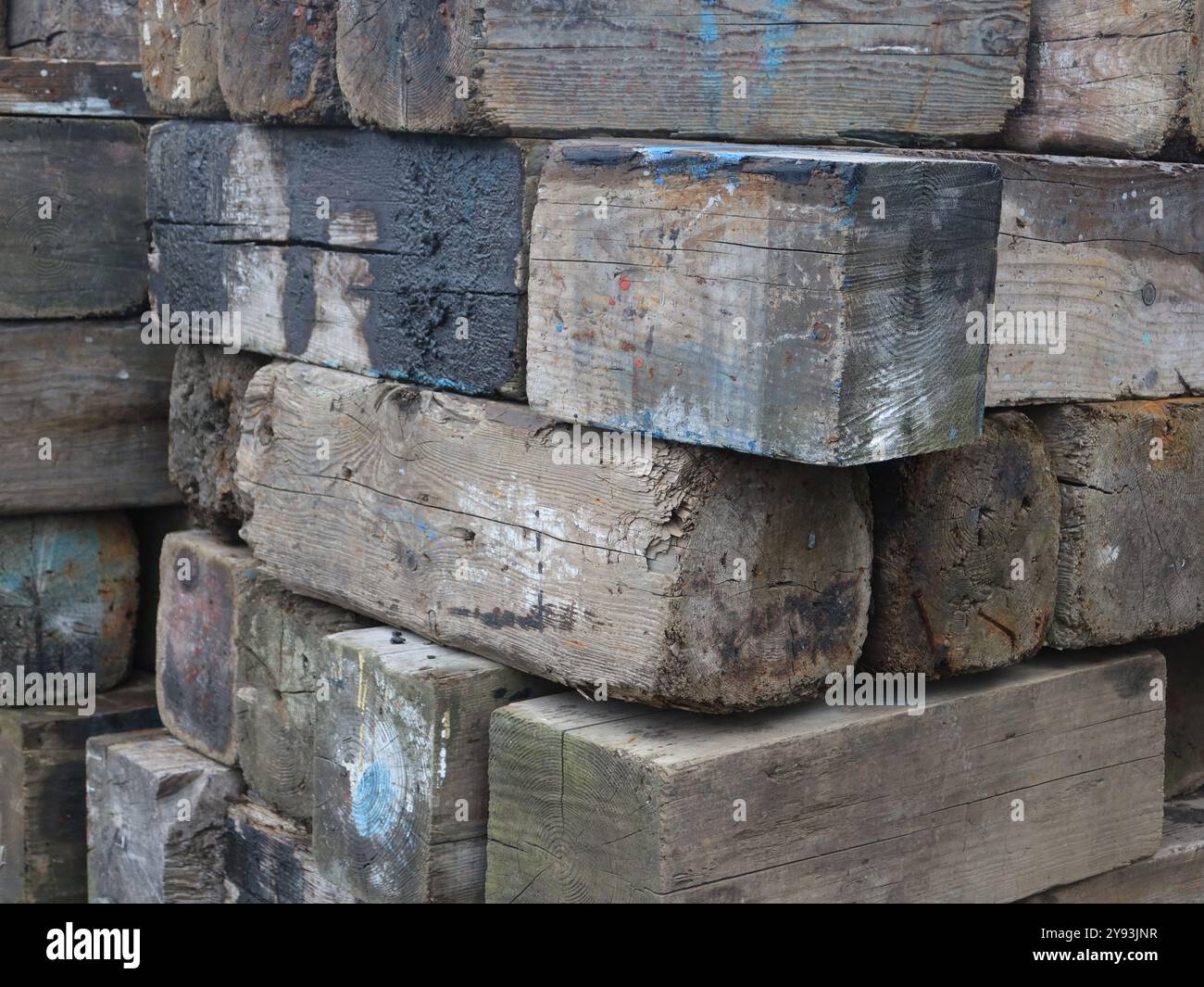 A stack of wooden blocks at a boatyard creates an abstract picture of ...