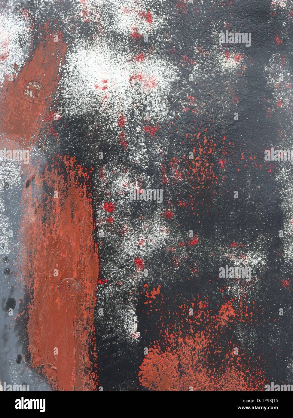 Abstract art: the rusty, flaking paint on the hull of a boat creates a ...