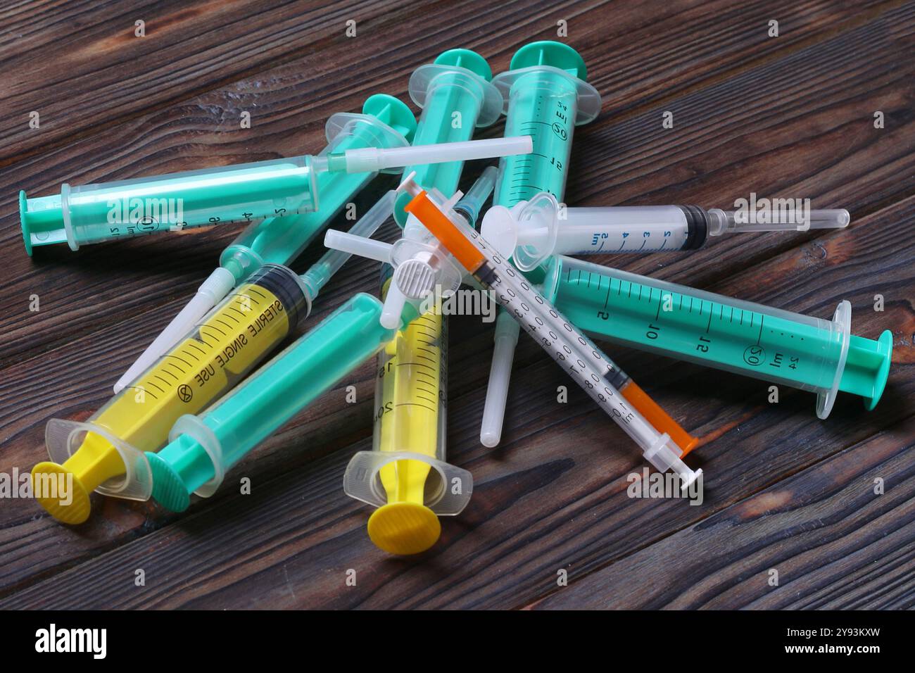 Top view of a pile of syringes and insulin syringes ready for injection ...
