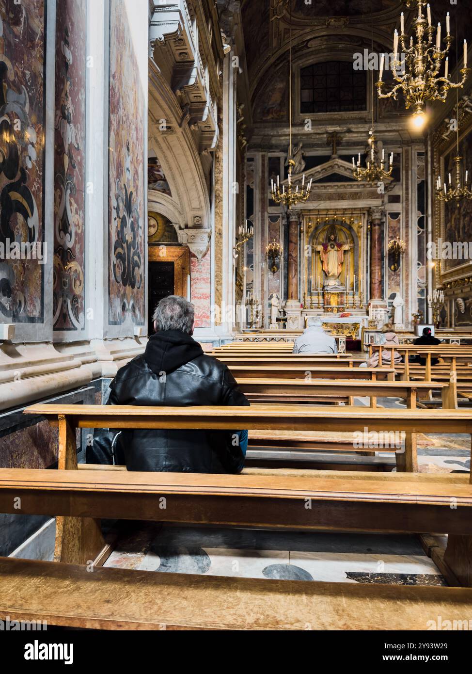 A Man Praying Inside An Old Church Stock Photo - Alamy