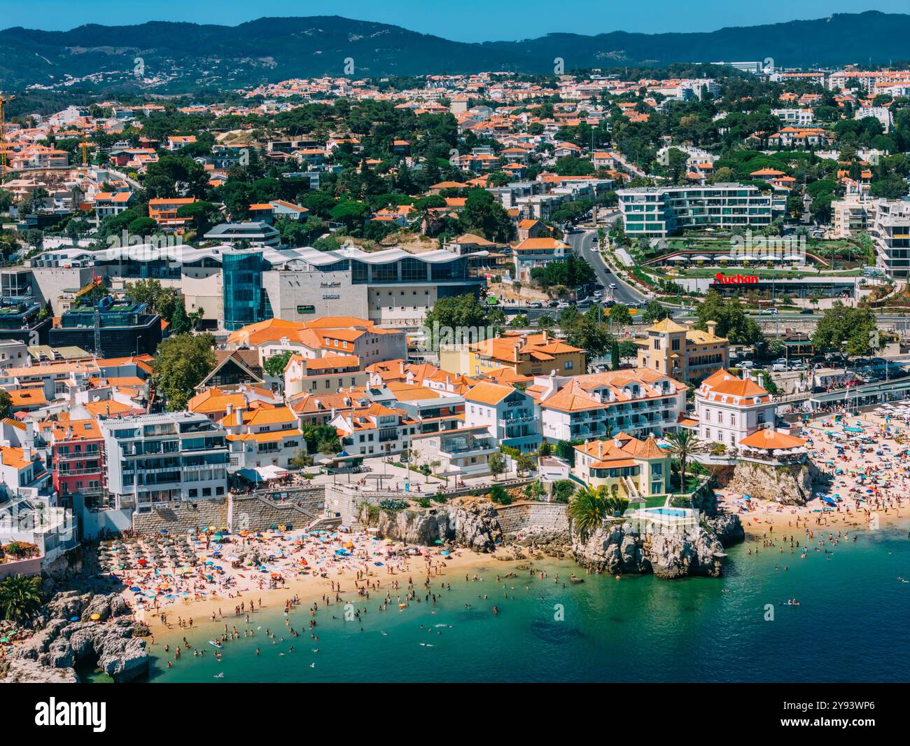 Aerial view of Cascais beaches and colourful rooftops of coastal town ...
