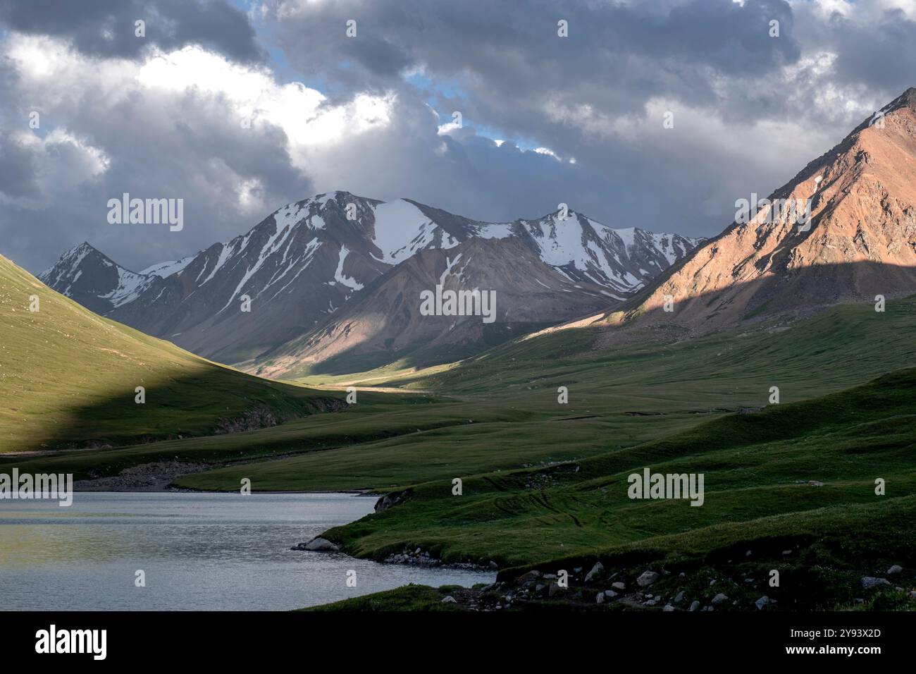 Scenic mountain landscape of Kyrgyzstan with lush Greenery and Snow ...