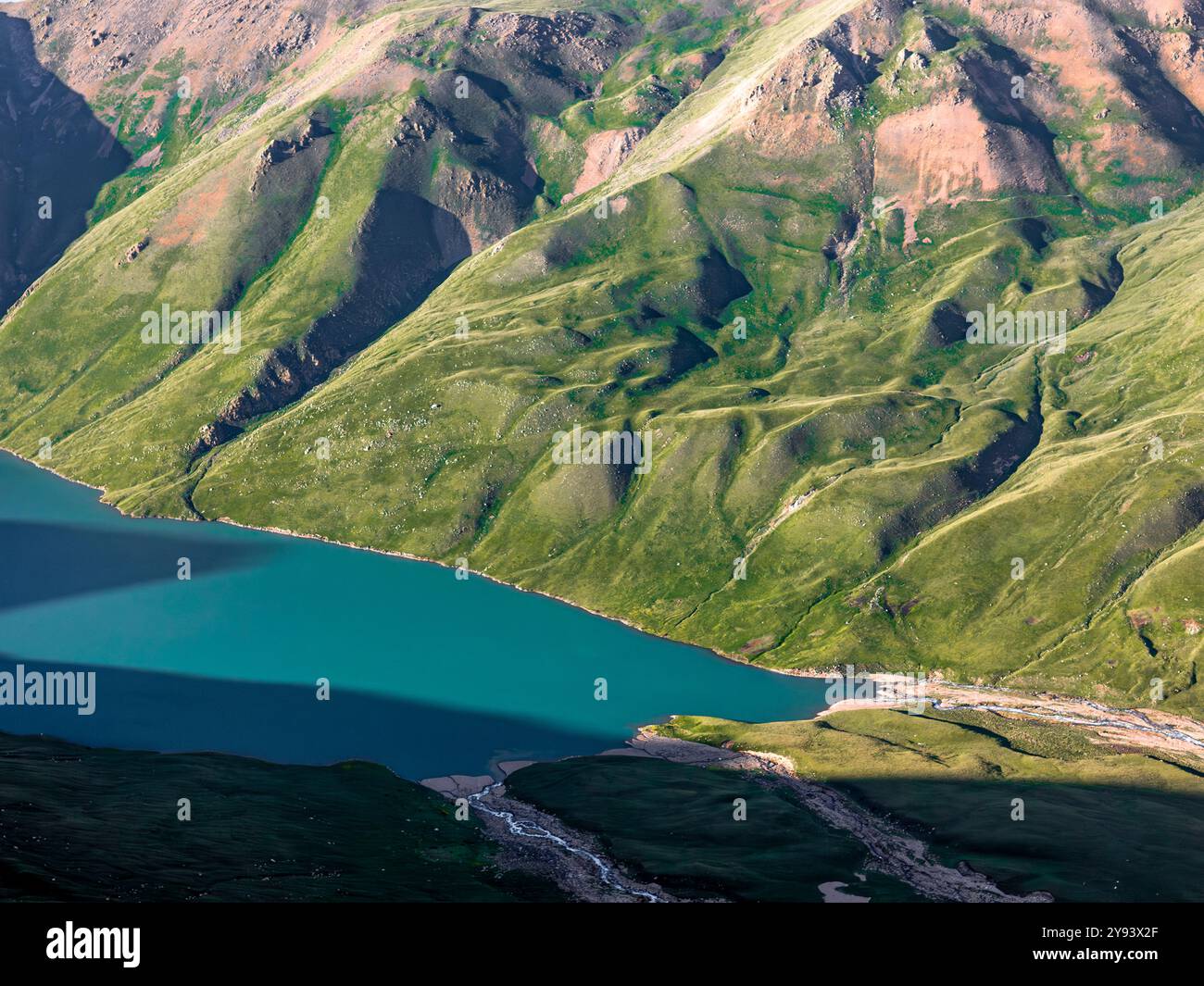 Aerial View of Kol Ukok Lake surrounded by Green Mountains under a blue ...