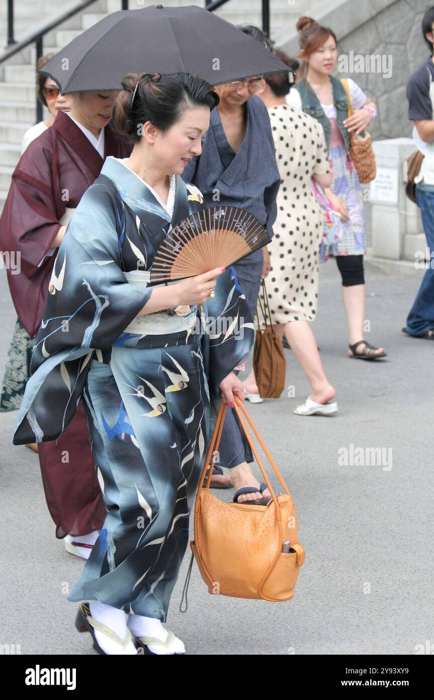 TOKYO, JAPAN-JULY 21,2008:Unidentified Japanese Women in kimono walking ...