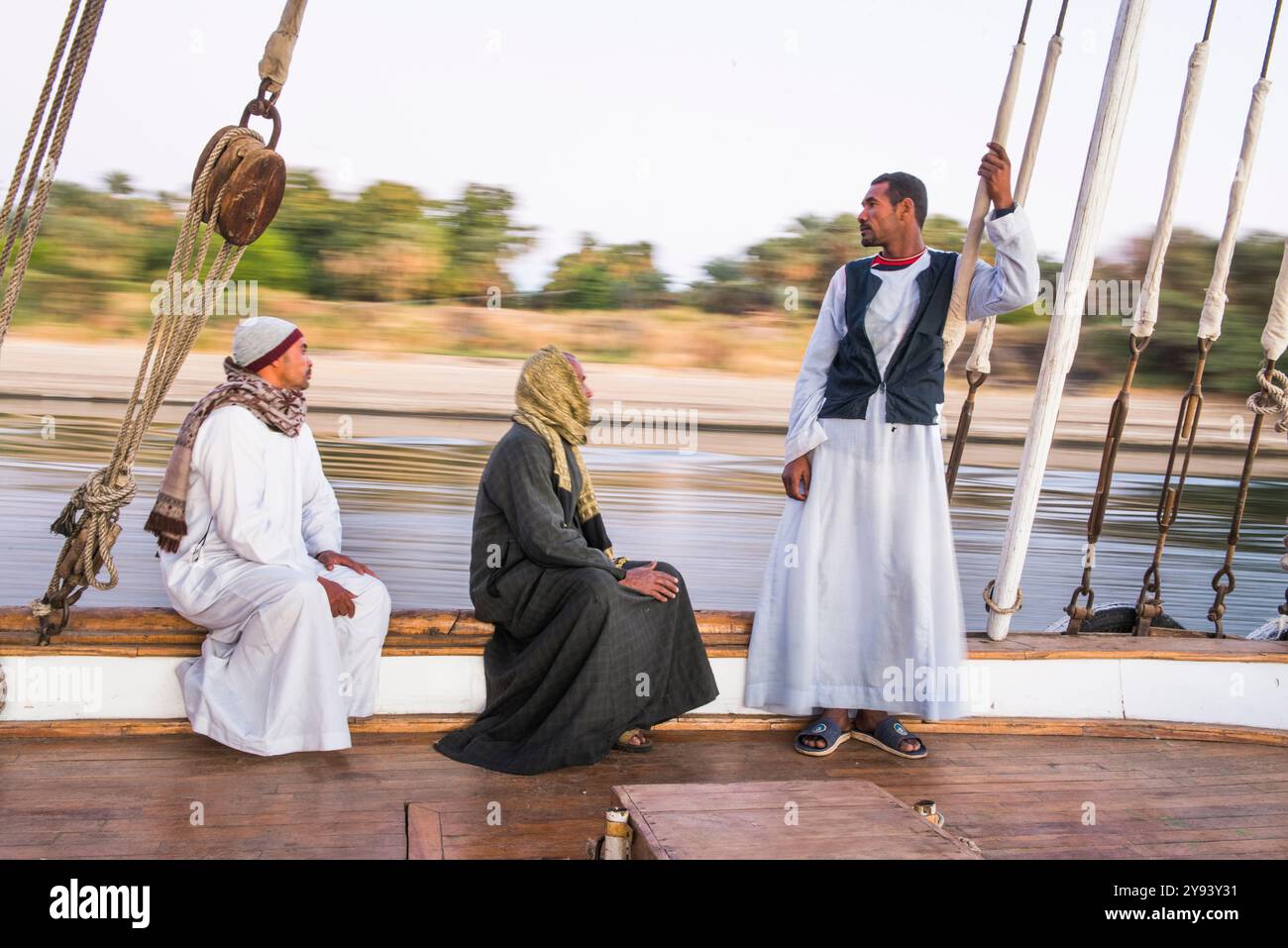 Members of the crew on board a dahabeah, passenger river boat of the ...