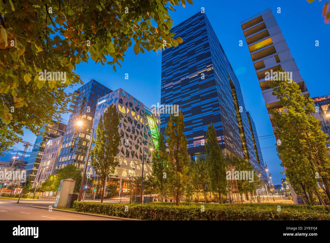 View of contemporary architecture in the Barcode area at dusk, Oslo ...