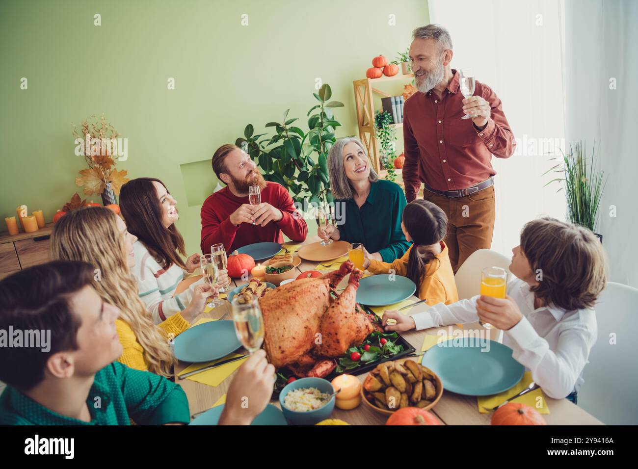 Photo of charming joyful big family celebrating thanksgiving day ...