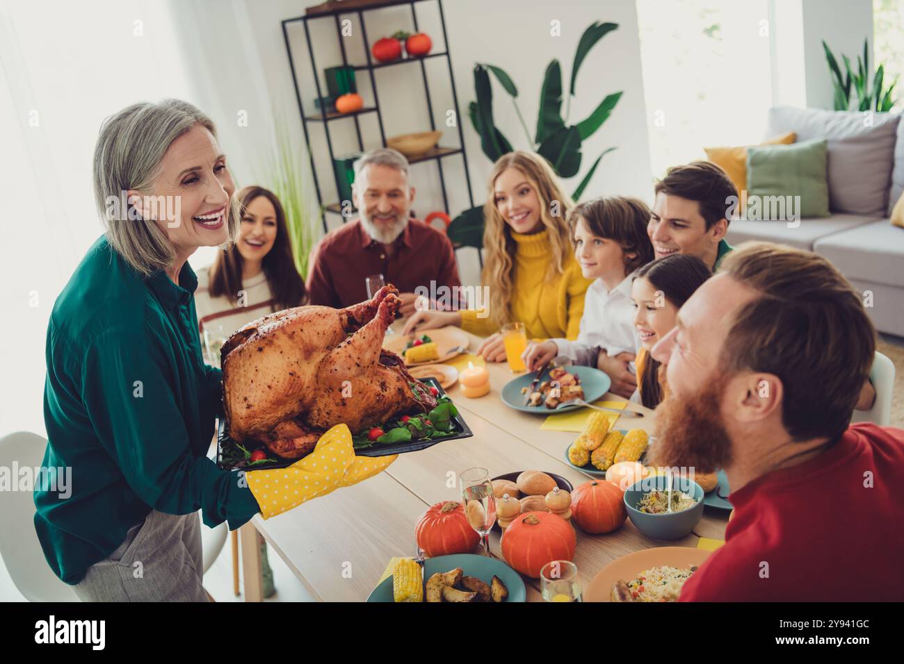 Photo of cheerful big family celebrating thanksgiving day together ...