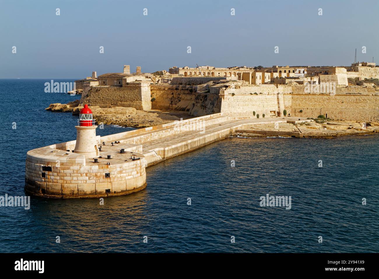 The Ricasoli Lighthouse at the entrance to the Grand Harbour of ...