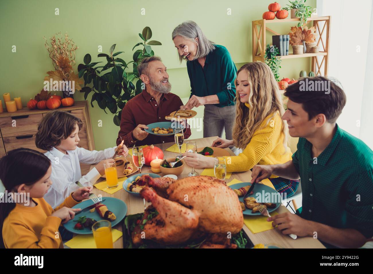 Photo of charming happy big family celebrating thanksgiving day cosy ...