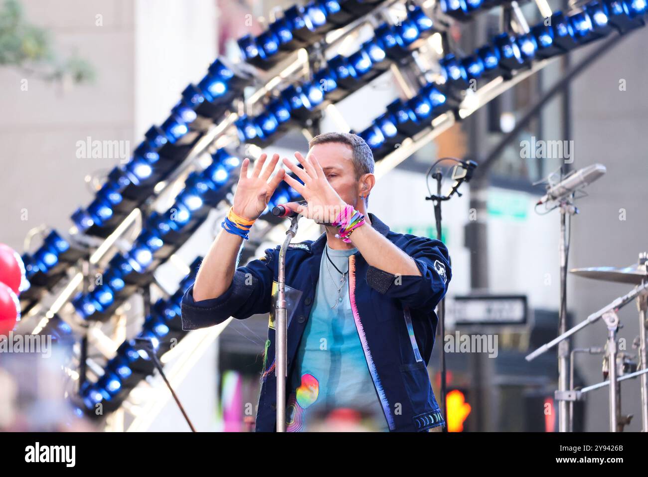 Vocalist Chris Martin along with his band Coldplay during a performance ...