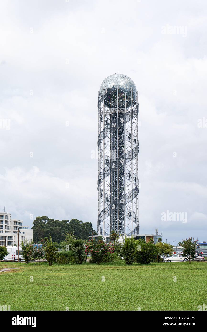 This image shows the striking Alphabet Tower in Batumi, which features ...